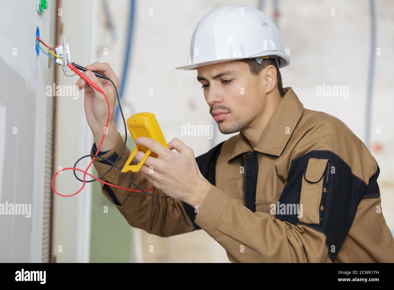 Male worker testing measuring hi-res stock photography and images - Alamy