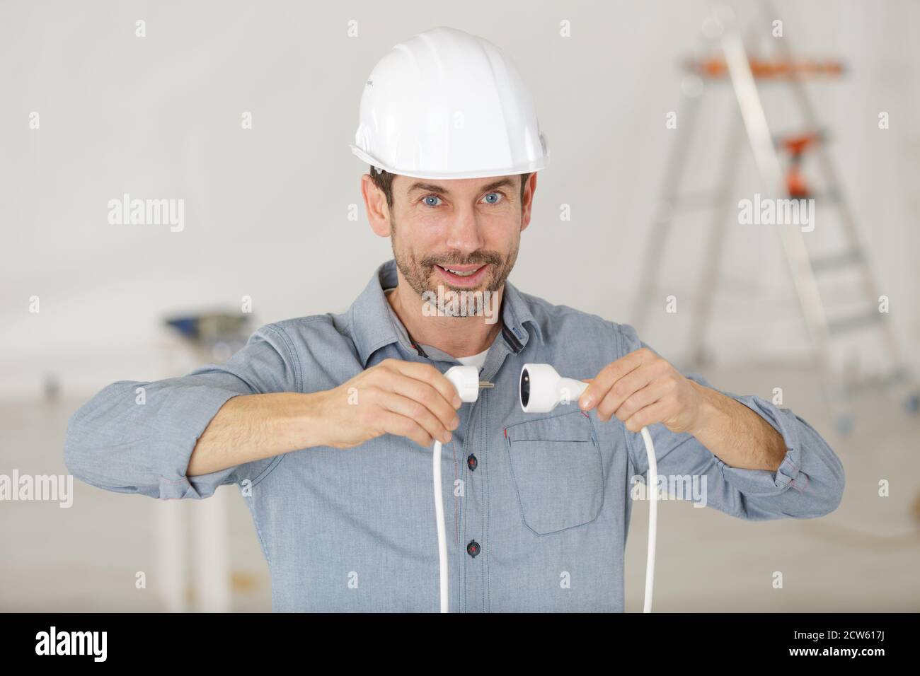 man with a hand and plug Stock Photo - Alamy