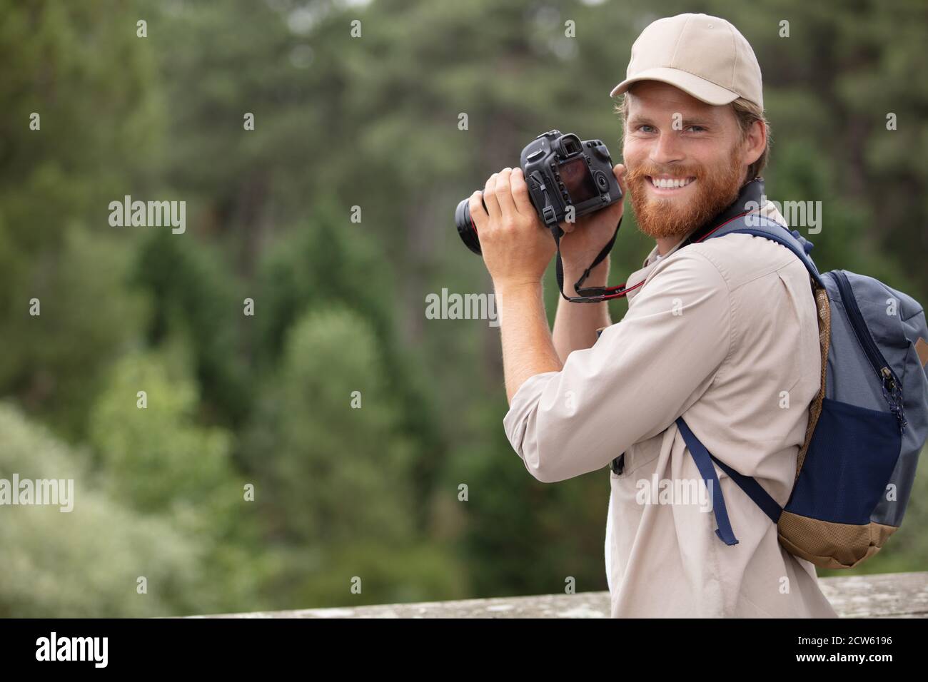 Male photographer looking photographs hi-res stock photography and ...