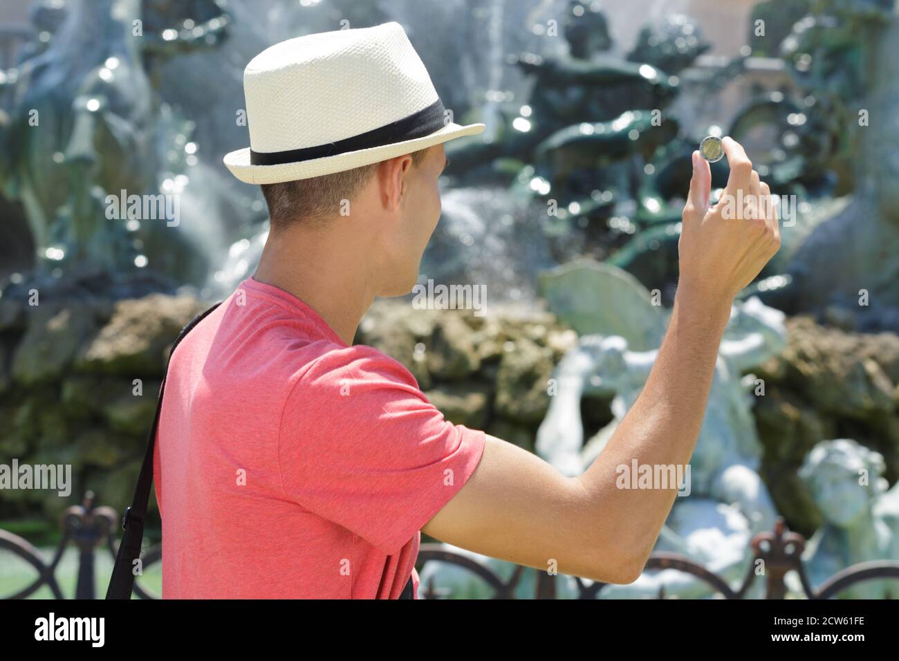People throwing coins into fountain hi-res stock photography and images ...