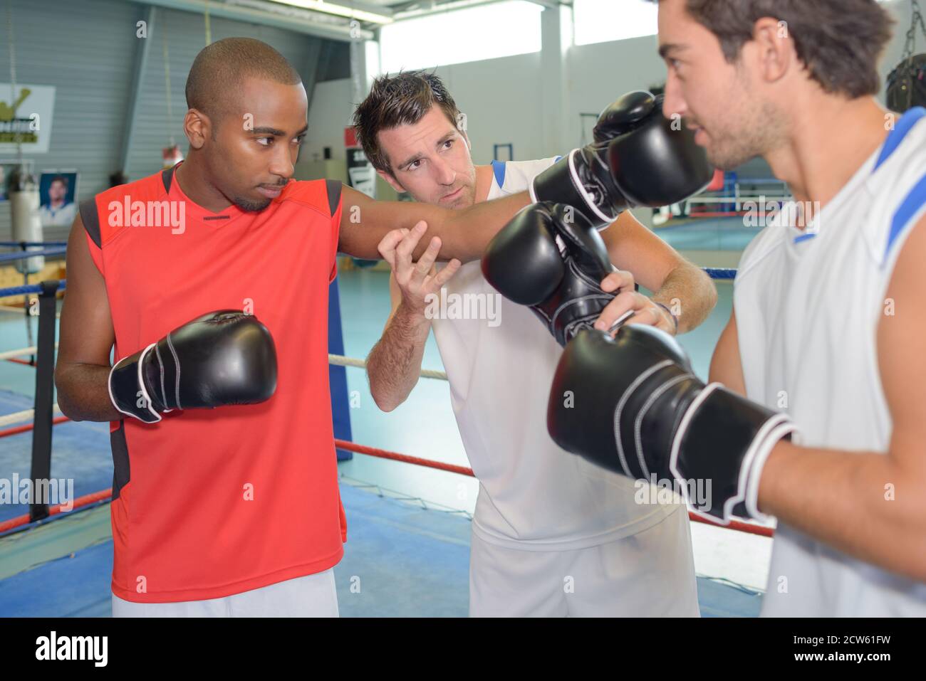 a coach training young boxers Stock Photo - Alamy