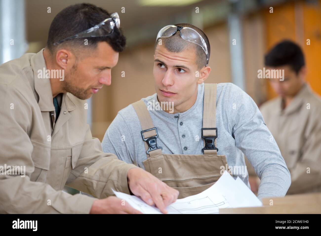 Two men constructing hi-res stock photography and images - Alamy