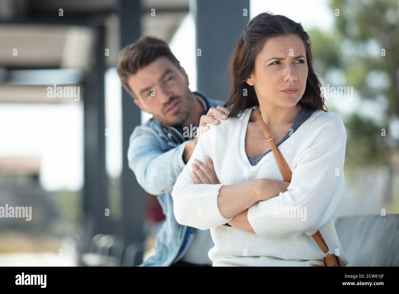 angry couple on a bench Stock Photo - Alamy