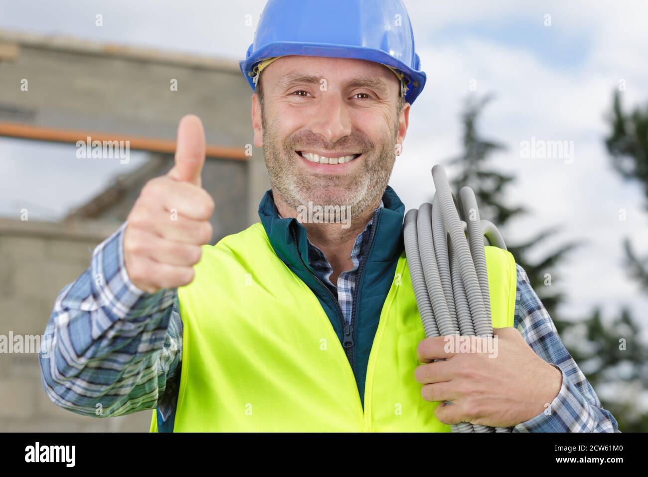 happy builder showing a thumb-up Stock Photo - Alamy