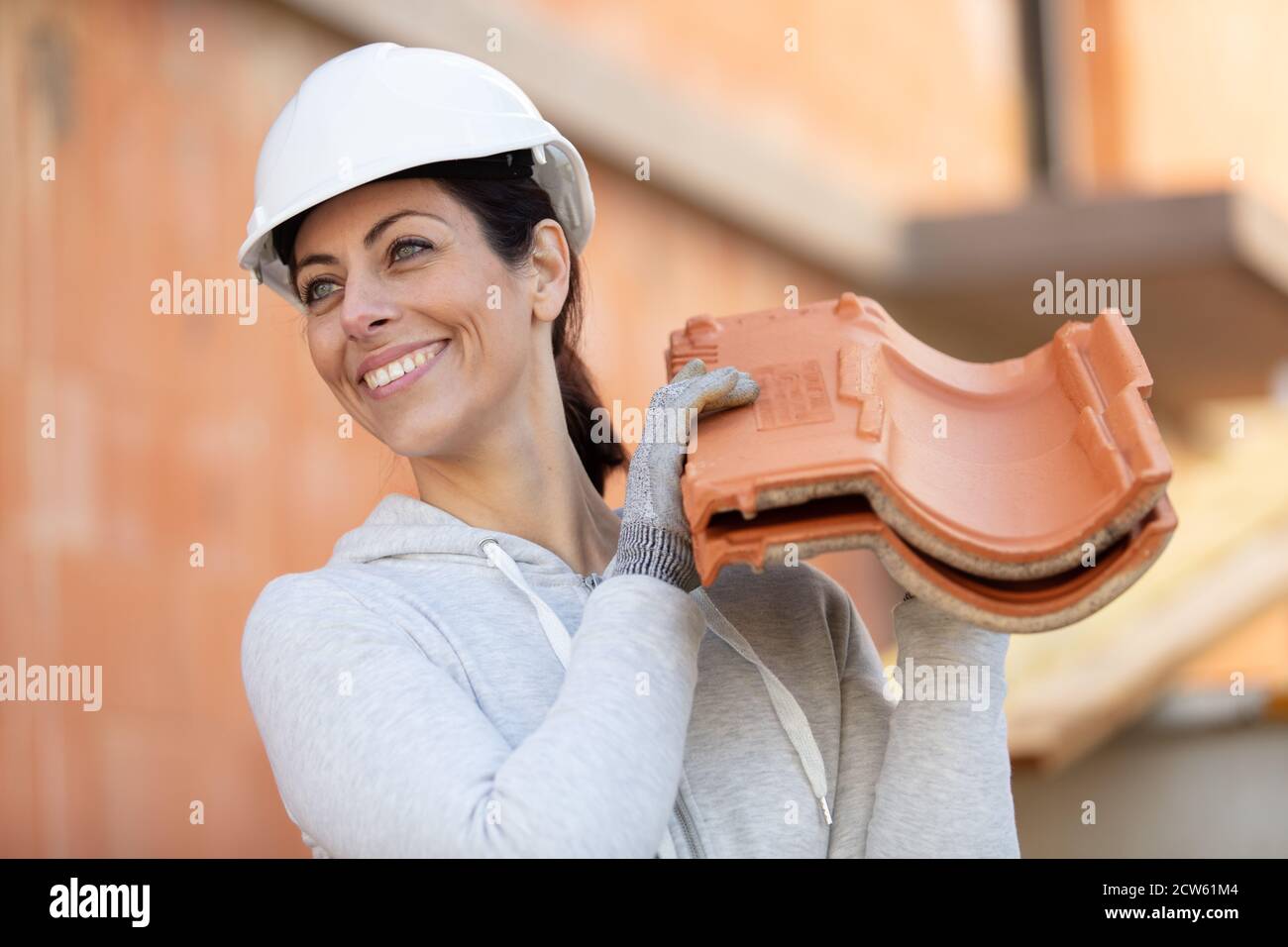 Holding bricks hi-res stock photography and images - Alamy