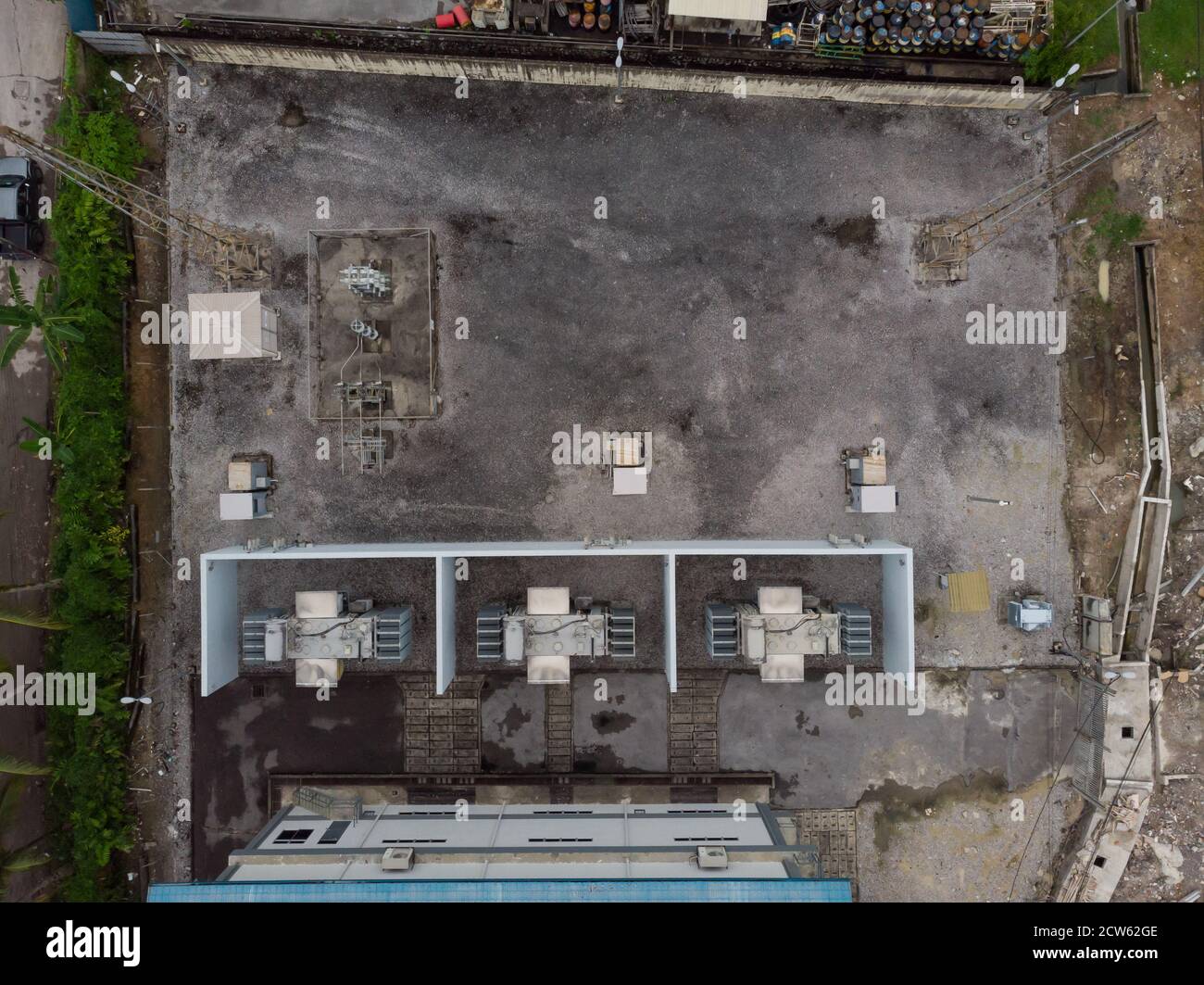 Aerial top view Electrical power plant, support residential and ...