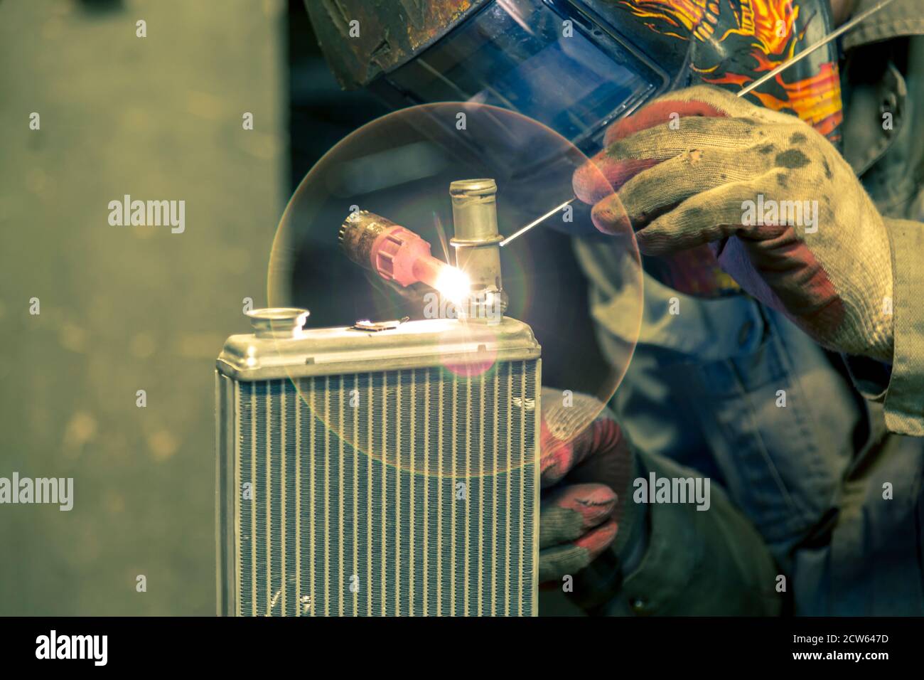 Argon arc welding aluminum radiator for car Stock Photo - Alamy