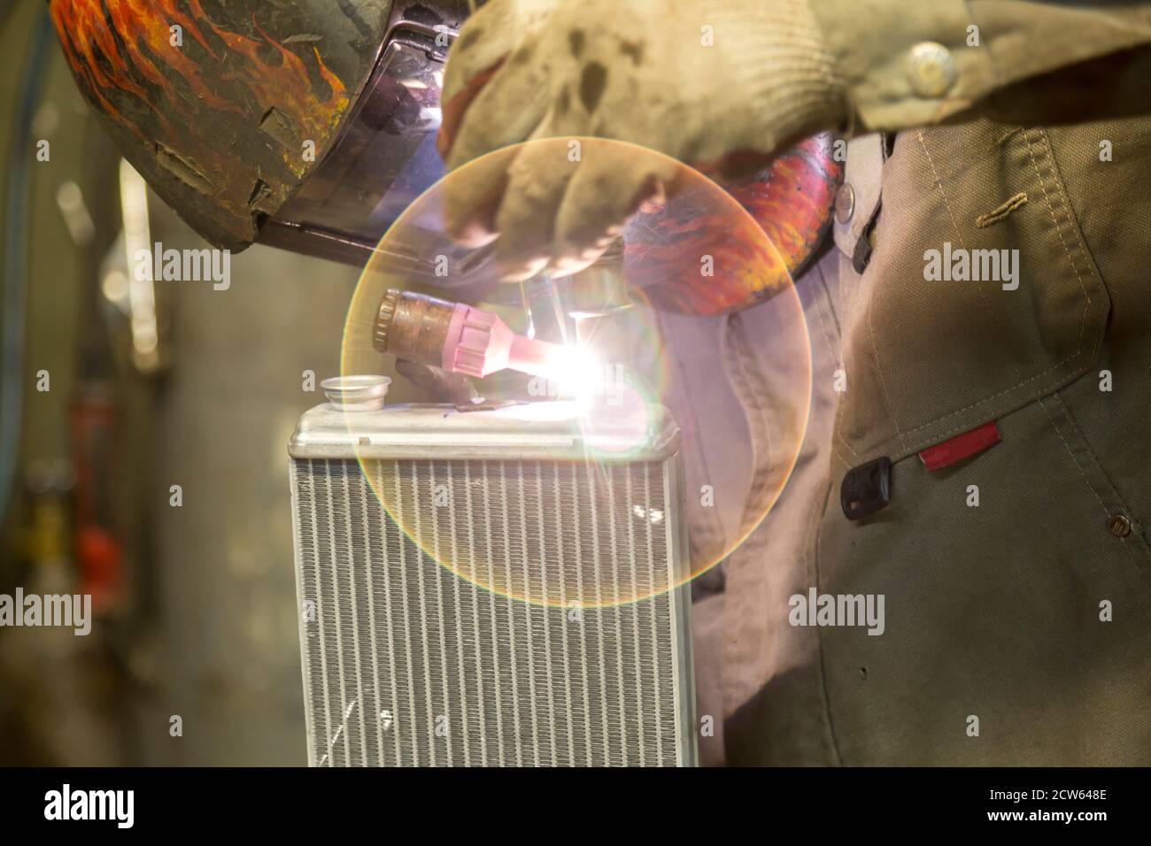 Argon arc welding aluminum radiator for car Stock Photo - Alamy