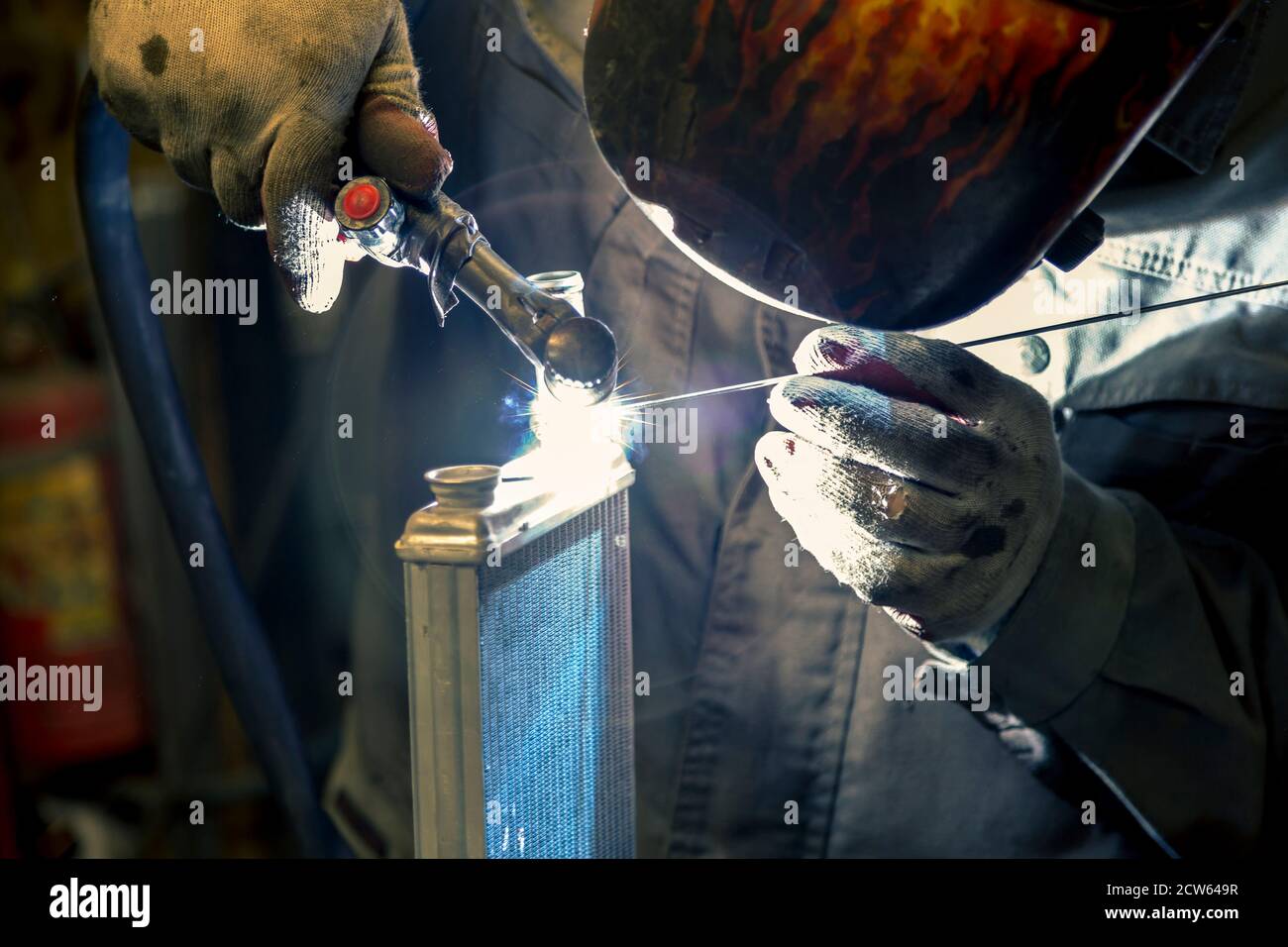 Argon arc welding aluminum radiator for car Stock Photo - Alamy