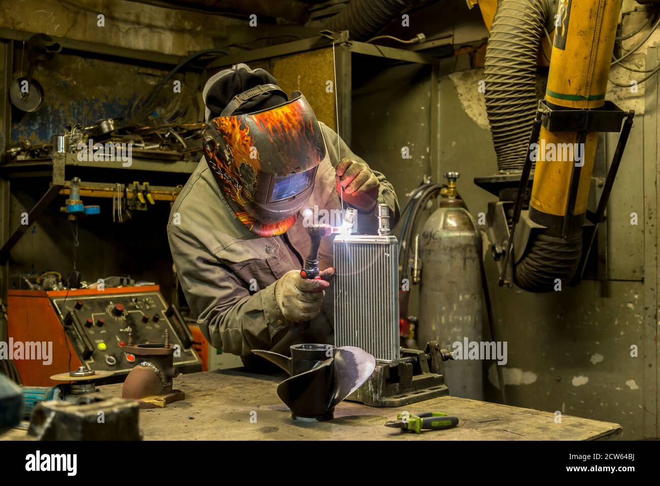 Argon arc welding aluminum radiator for car Stock Photo - Alamy