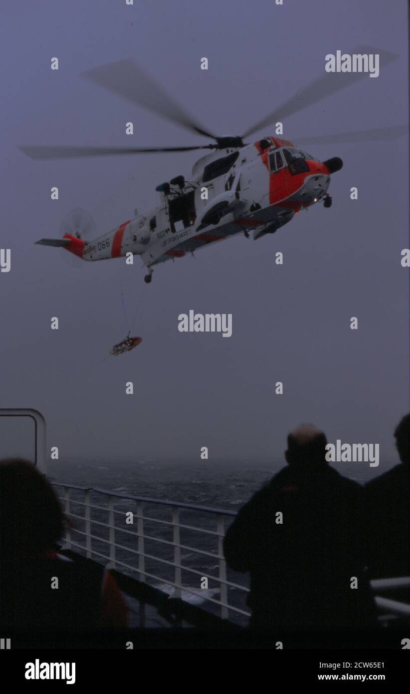 Passenger being airlifted medivacced by Norwegian helicopter rescue ...