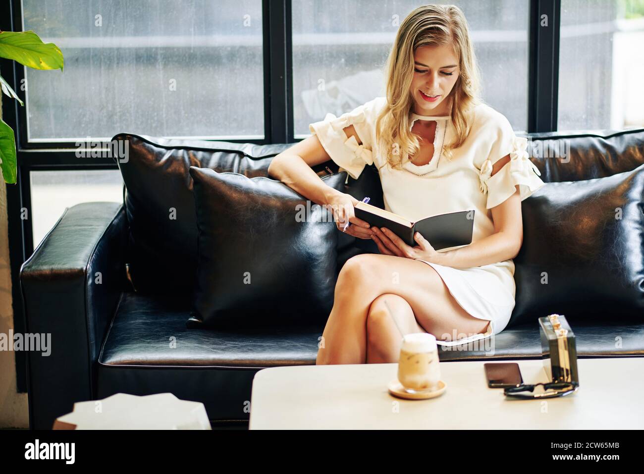 Elegant woman reading book Stock Photo - Alamy