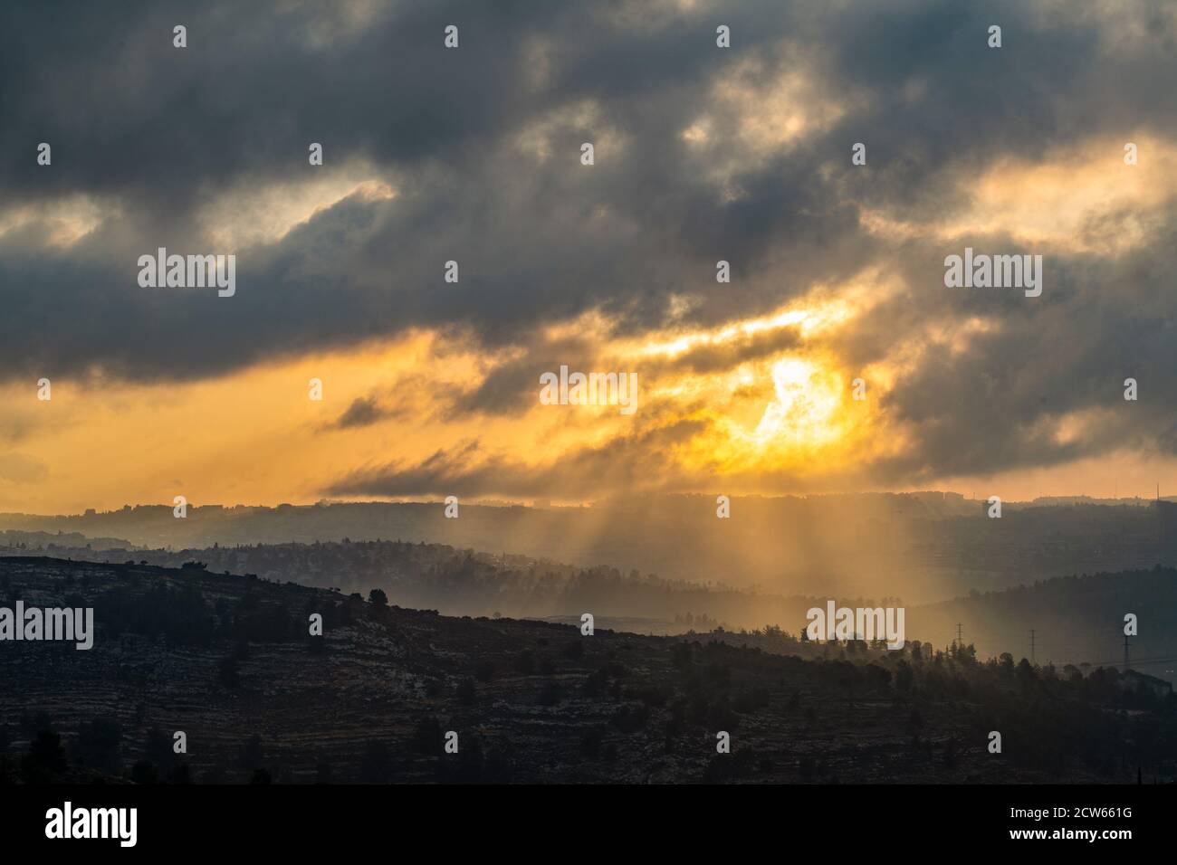 A cloudy sunrise over Jerusalem, Israel and the hazy Judea mountain ...