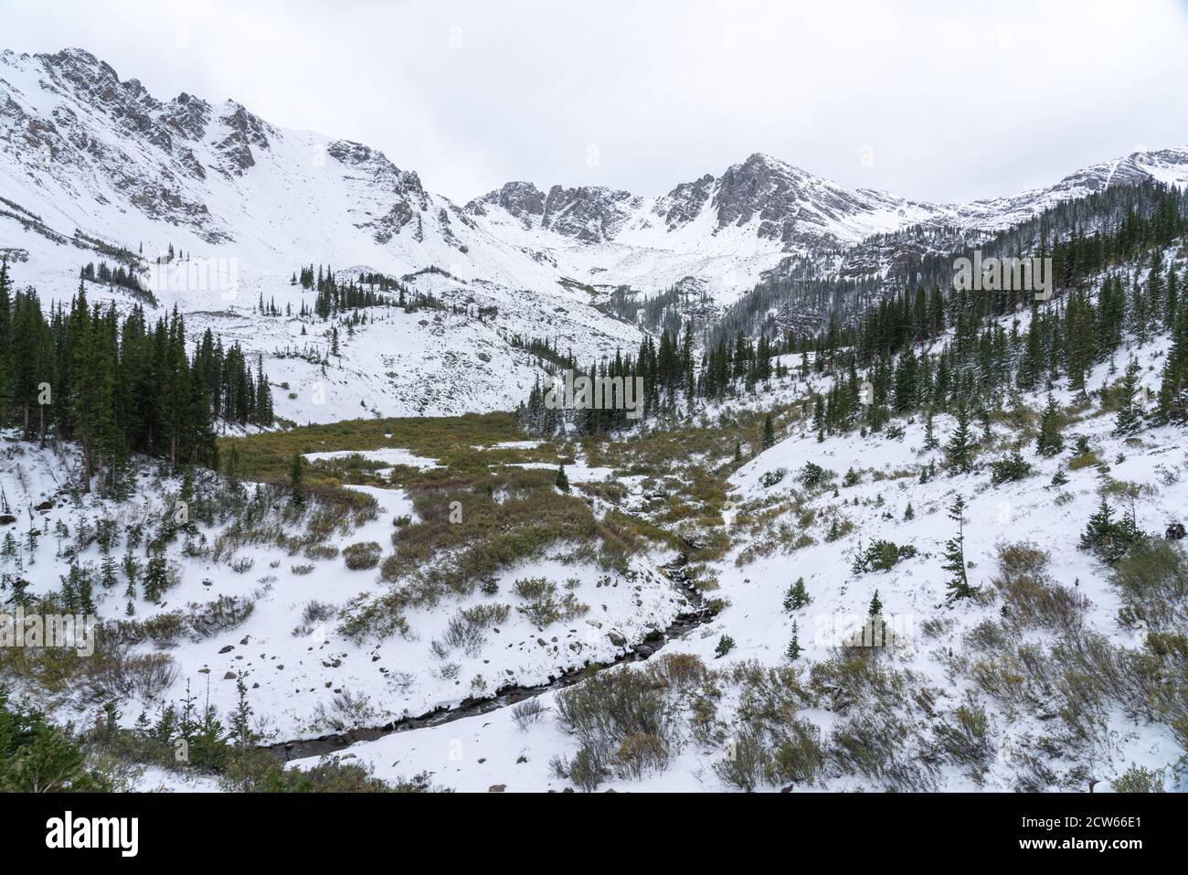 Summer snow covering the ground during a hike to Cathedral Lake near Aspen, Colorado Stock Photo ...
