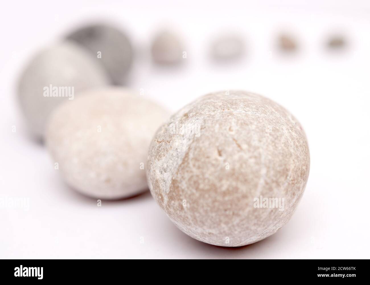 Stones on white background Stock Photo - Alamy