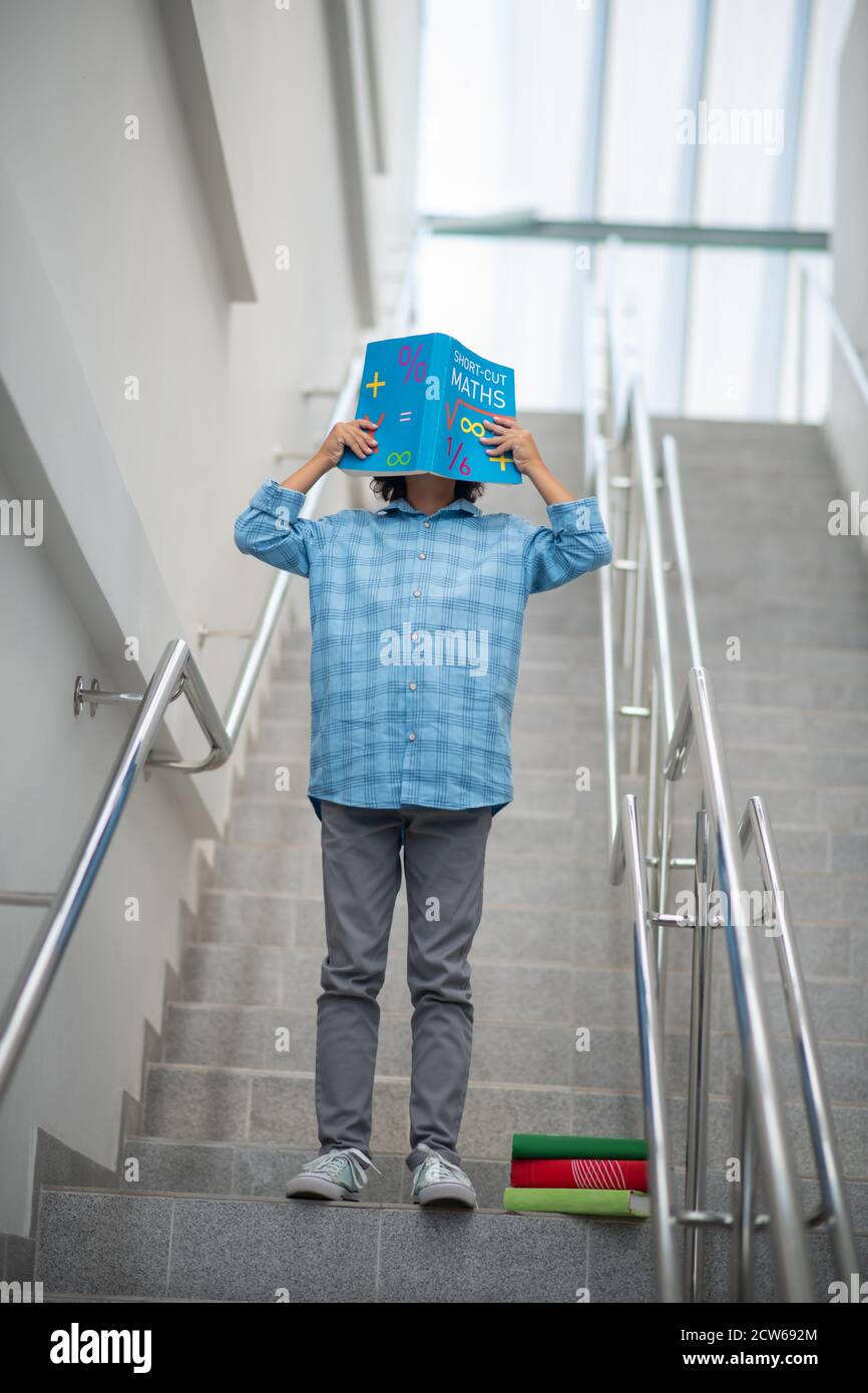 Boy closing book hi-res stock photography and images - Alamy