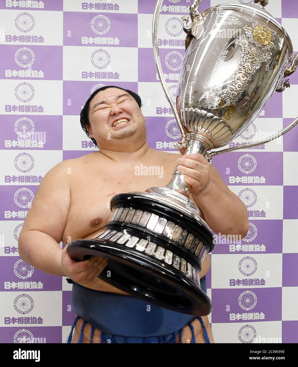 Sekiwake Shodai poses for a photo with his trophy after winning his ...