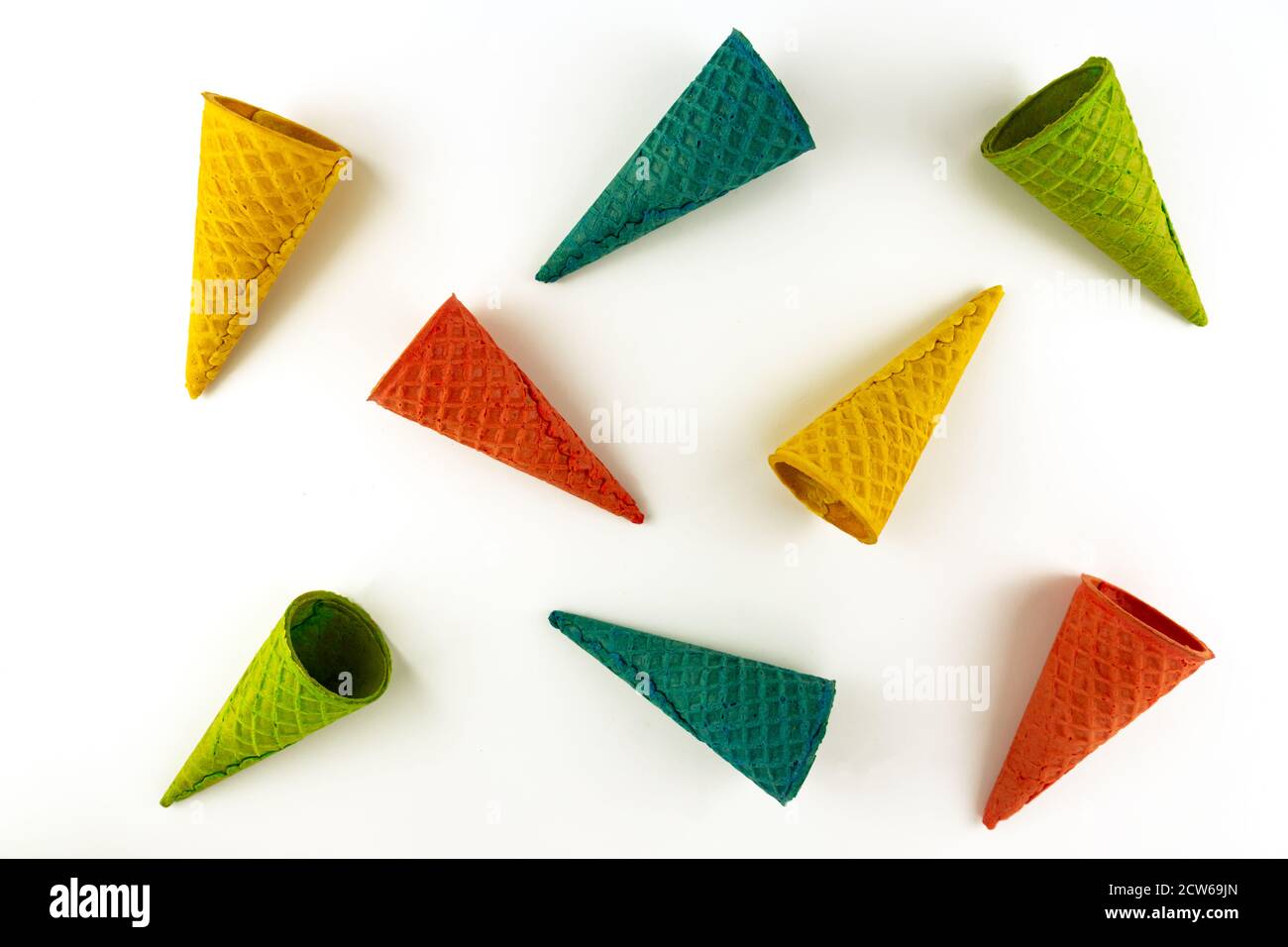 Set of various bright multicolored ice-cream waffle cones on white ...