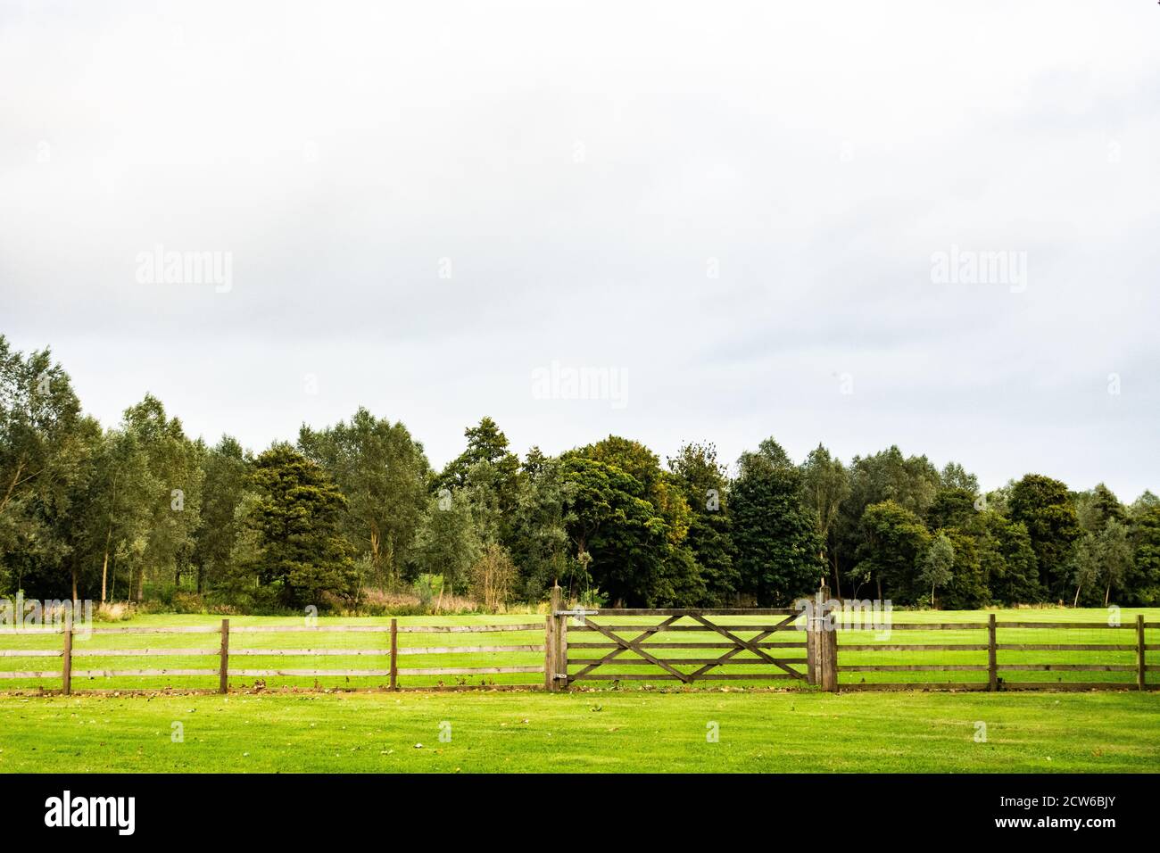 Wooden Five Bar farmers field gate with plain field beyond Stock Photo ...