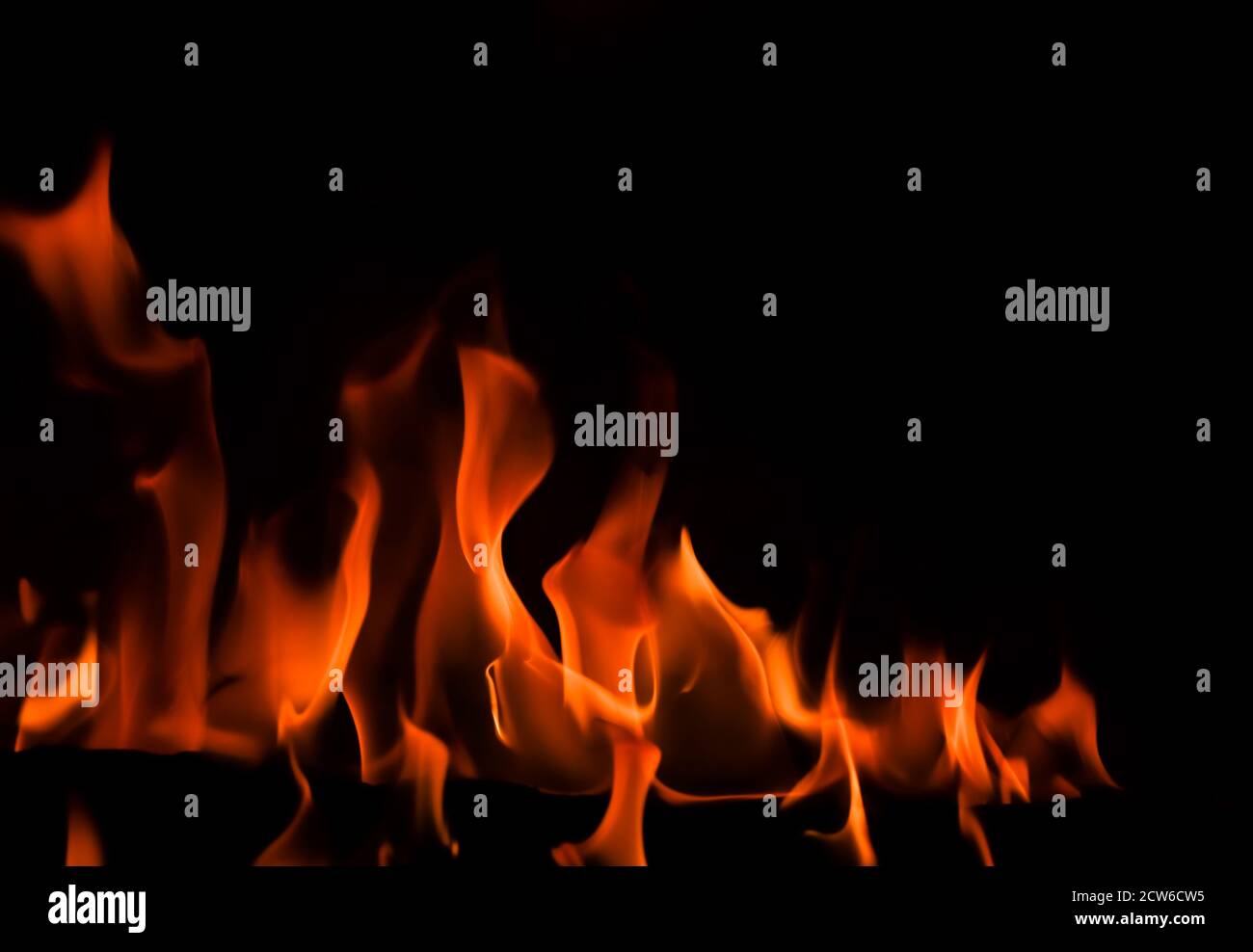 Red blaze Fire flame on a black background Stock Photo - Alamy