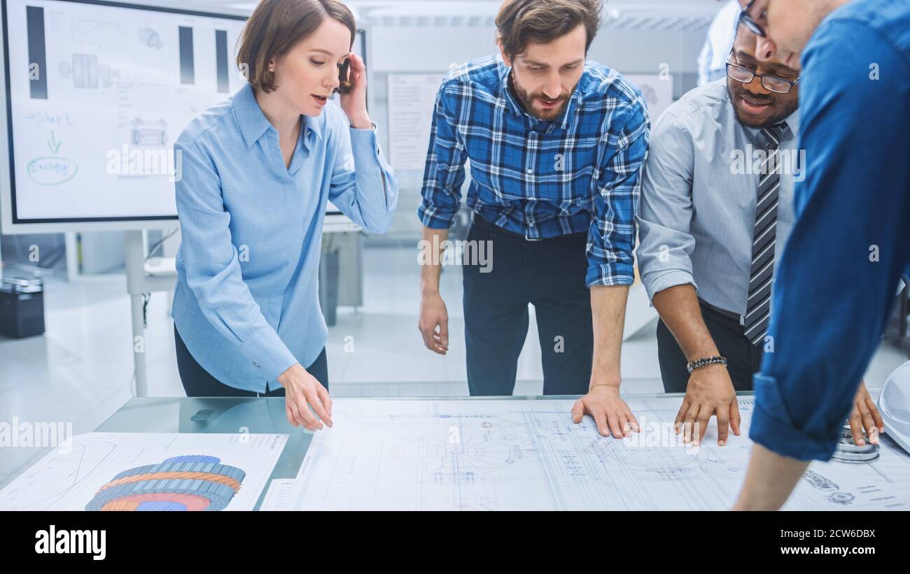 In the Industrial Engineering Facility: Diverse Group of Engineers and ...