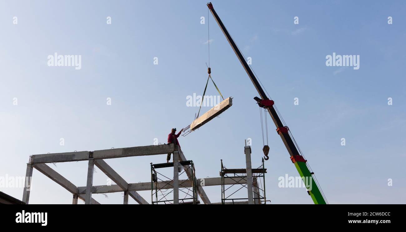 Construction crane lifting precast concrete hi-res stock photography ...