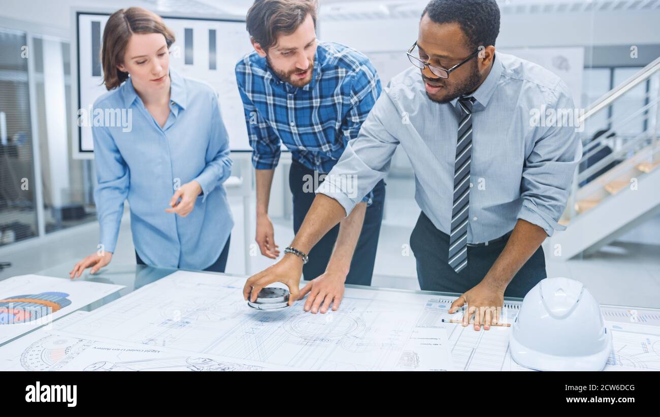 In the Industrial Engineering Facility: Diverse Group of Engineers and ...