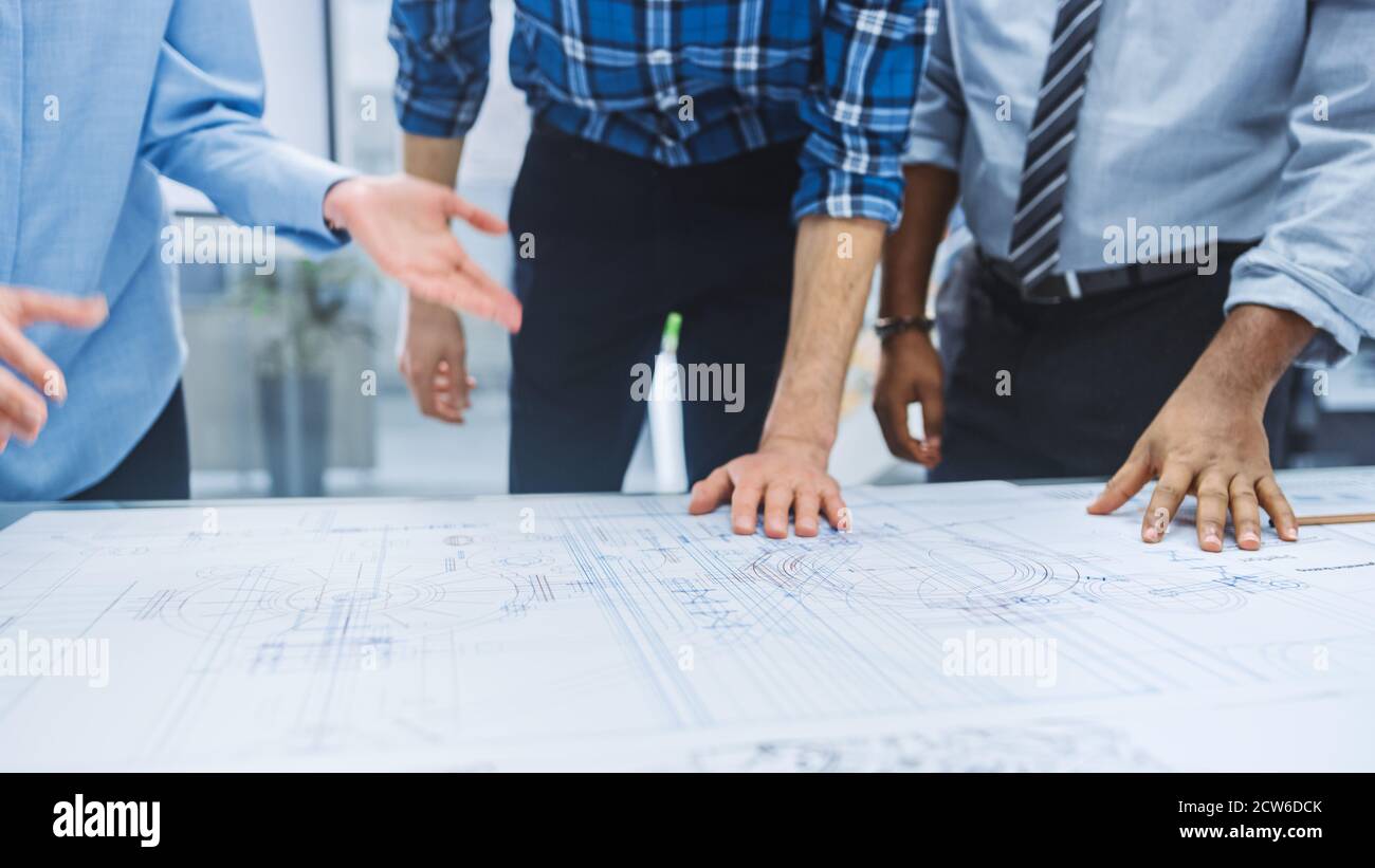 In the Industrial Engineering Facility: Diverse Group of Engineers and ...