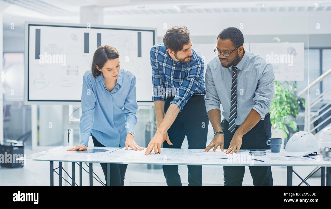 In the Industrial Engineering Facility: Diverse Group of Engineers and ...