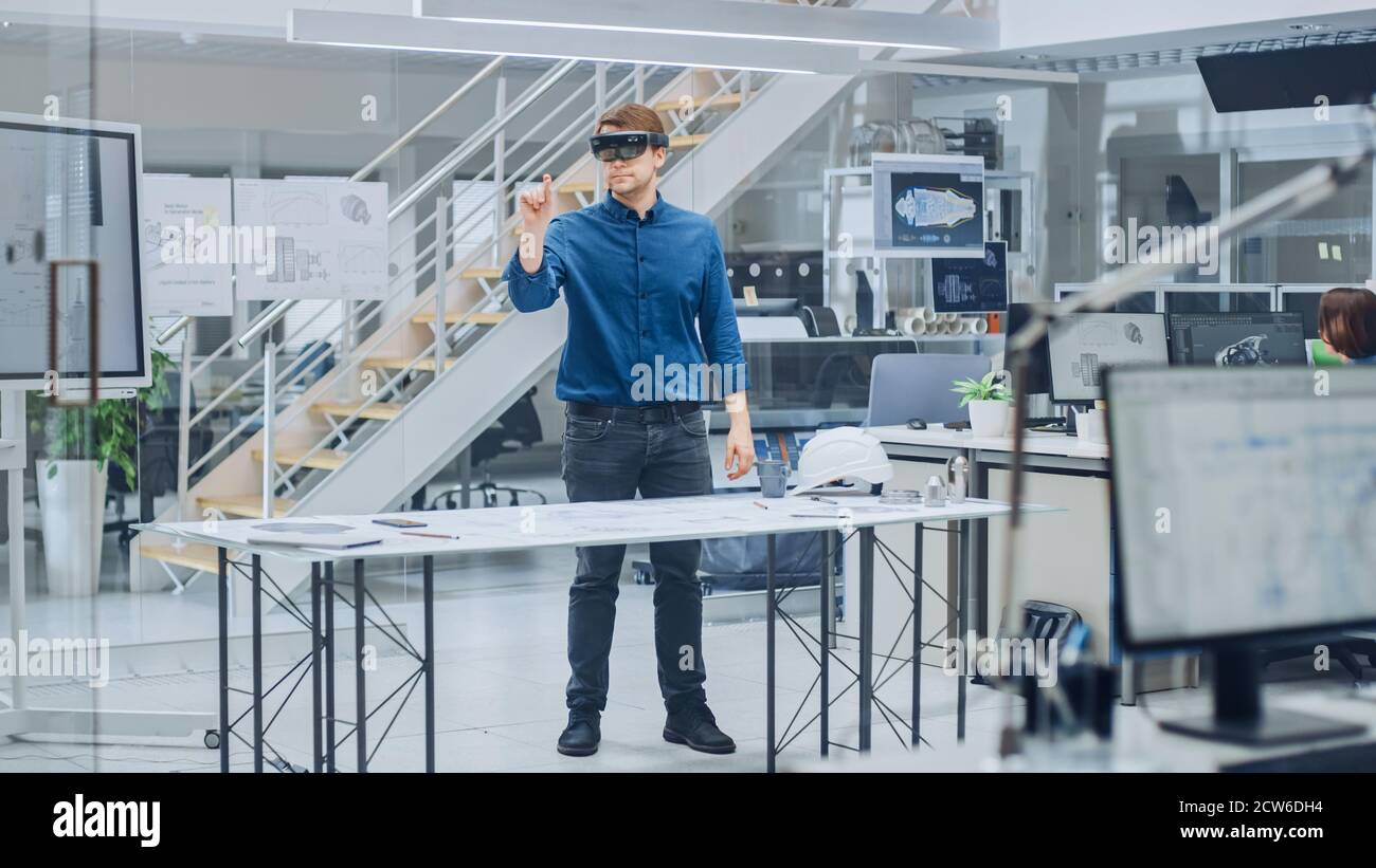 Engineering Software Developer Wearing Virtual Reality Headset Uses Gestures to Interact with ...