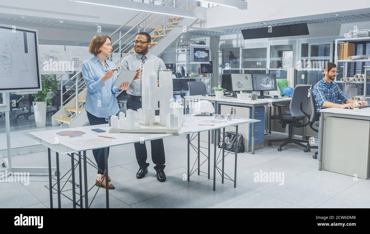 In Architectural Bureau: Team of Architects and Engineers Working on a ...