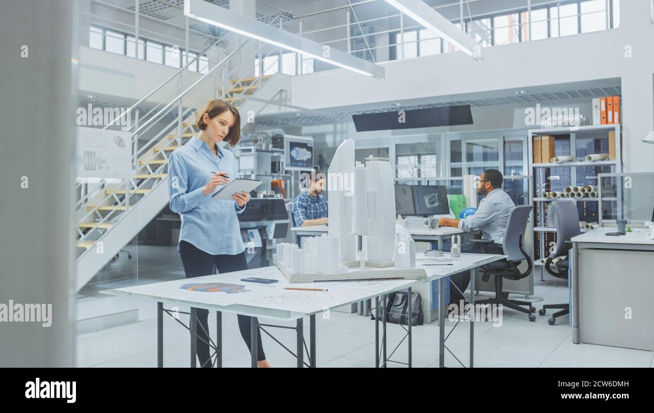 In Architectural Bureau: Team of Architects and Engineers Working on a ...