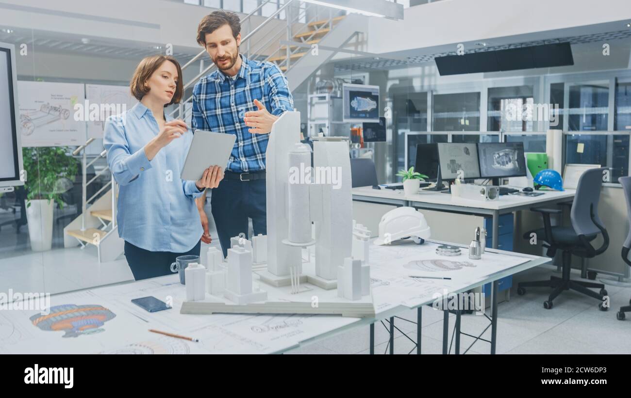 In Architectural Bureau: Architect and Engineer Talking, Using Digital ...