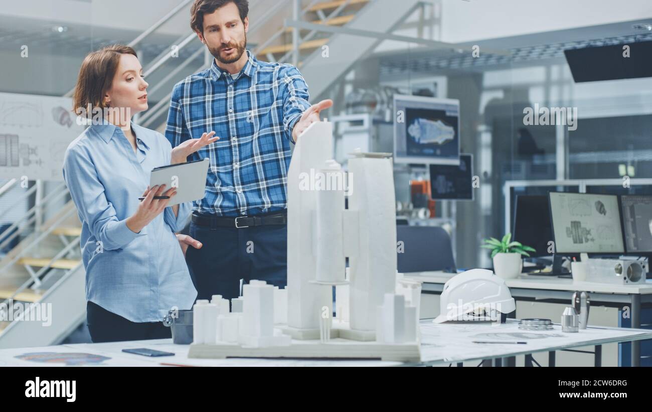 In Architectural Bureau: Architect and Engineer Talking, Working on a ...