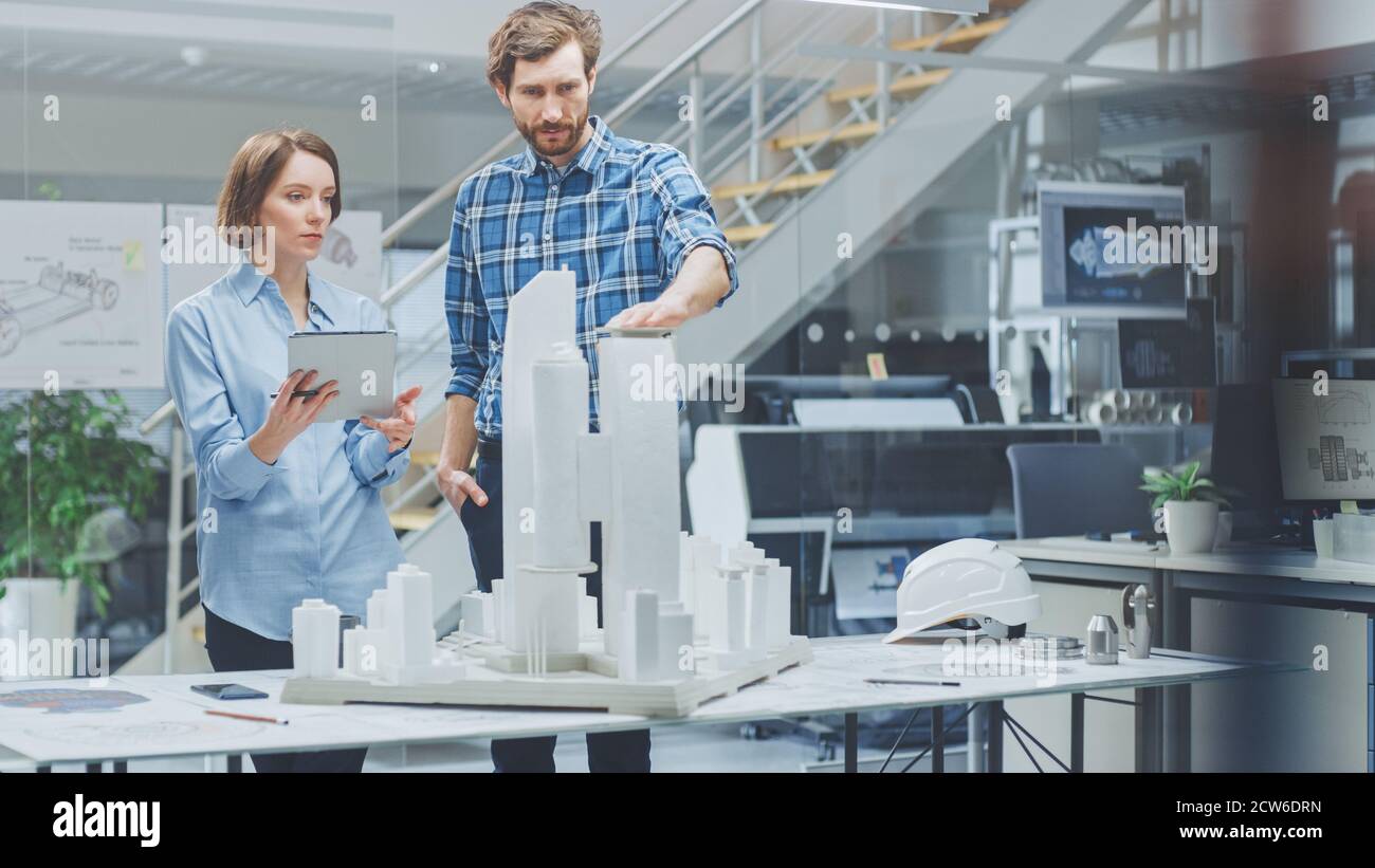 In Architectural Bureau: Architect and Engineer Talking, Working on a ...