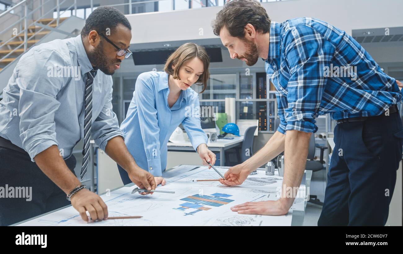 In the Industrial Engineering Facility: Female Designer Works with ...