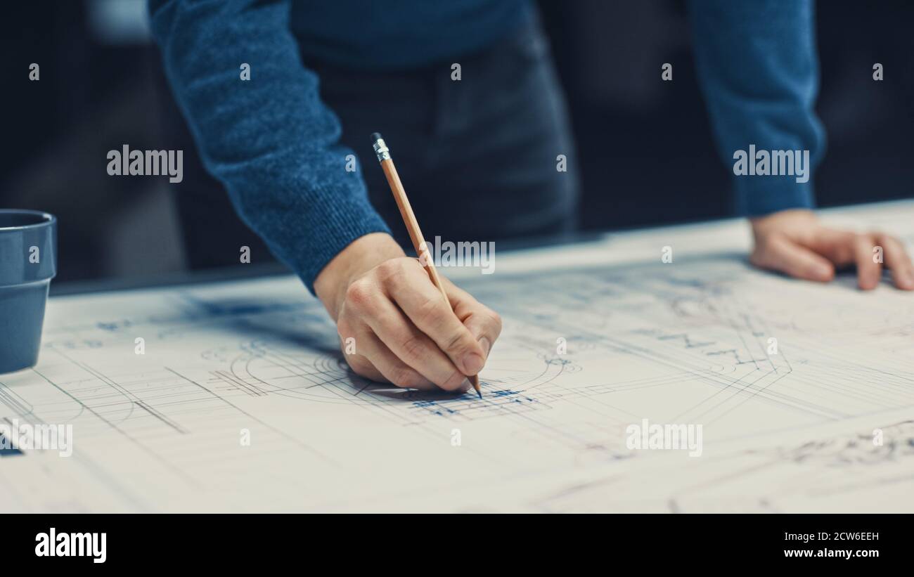 In the Dark Industrial Design Engineering Facility: Male Engineer Works ...