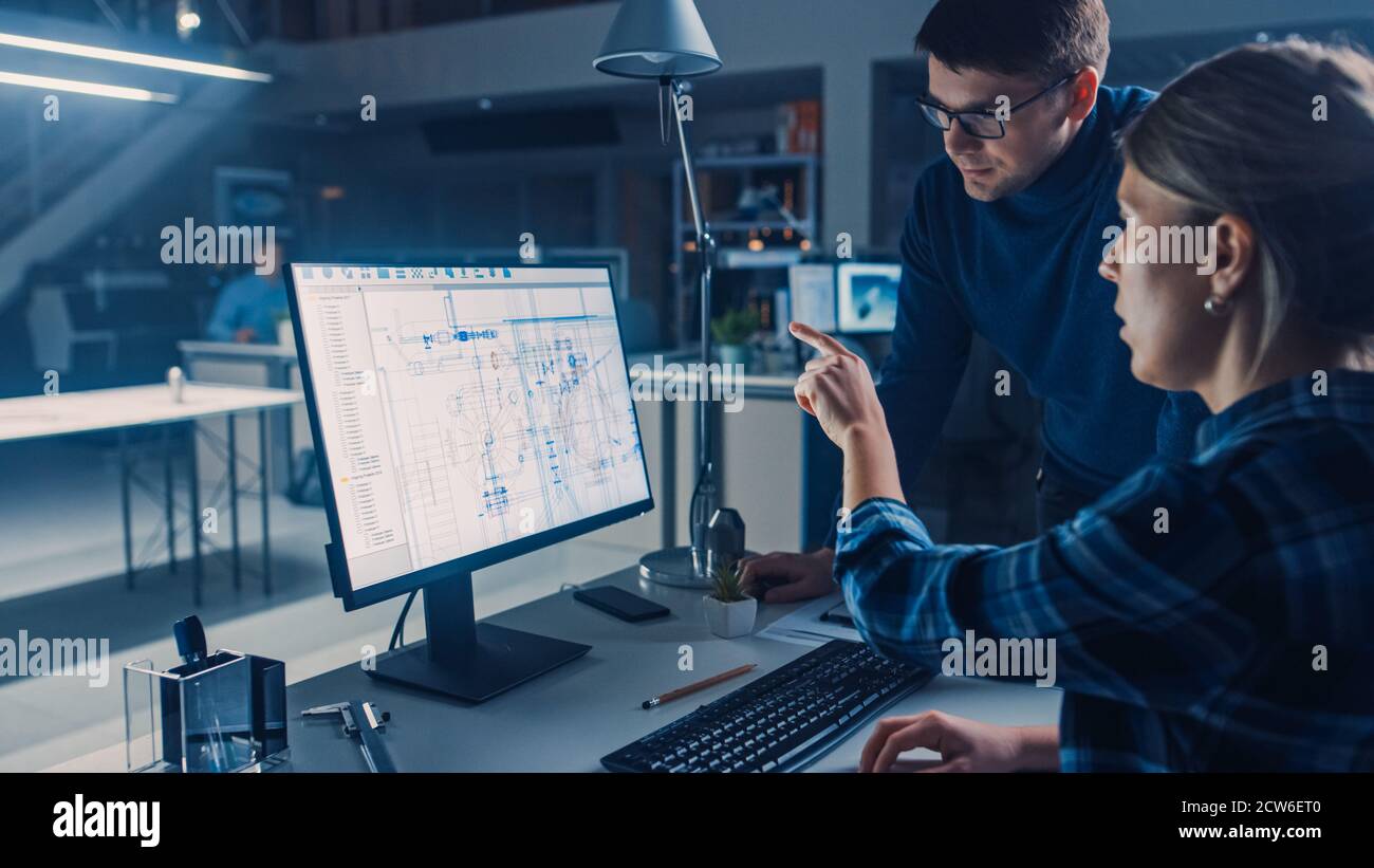 Engineer Working on Desktop Computer, Screen Showing CAD Software with ...