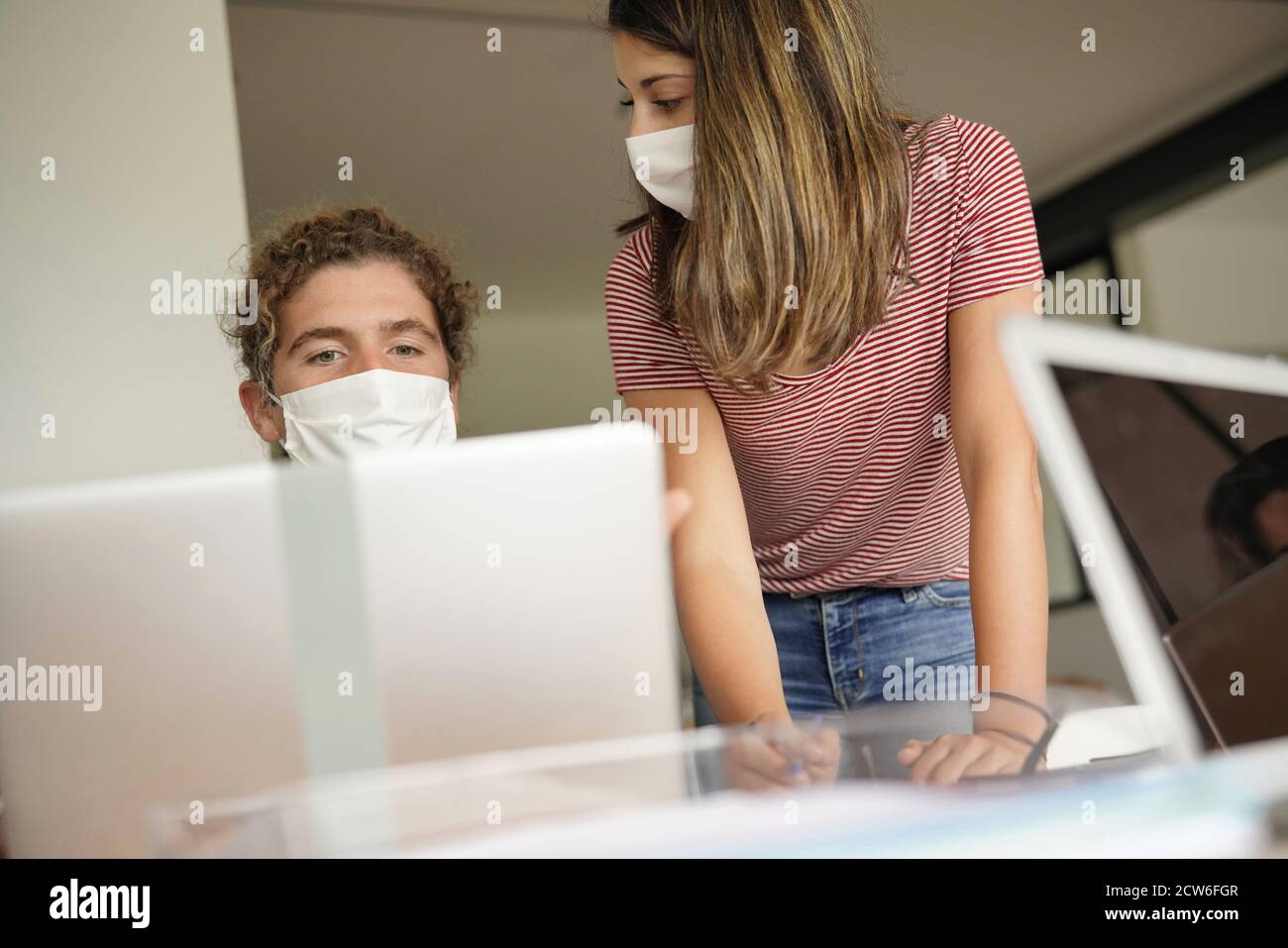 group of students working wearing masks Stock Photo - Alamy
