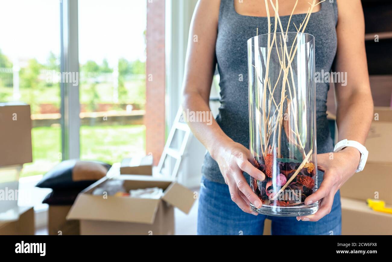 Woman placing flowers hi-res stock photography and images - Alamy