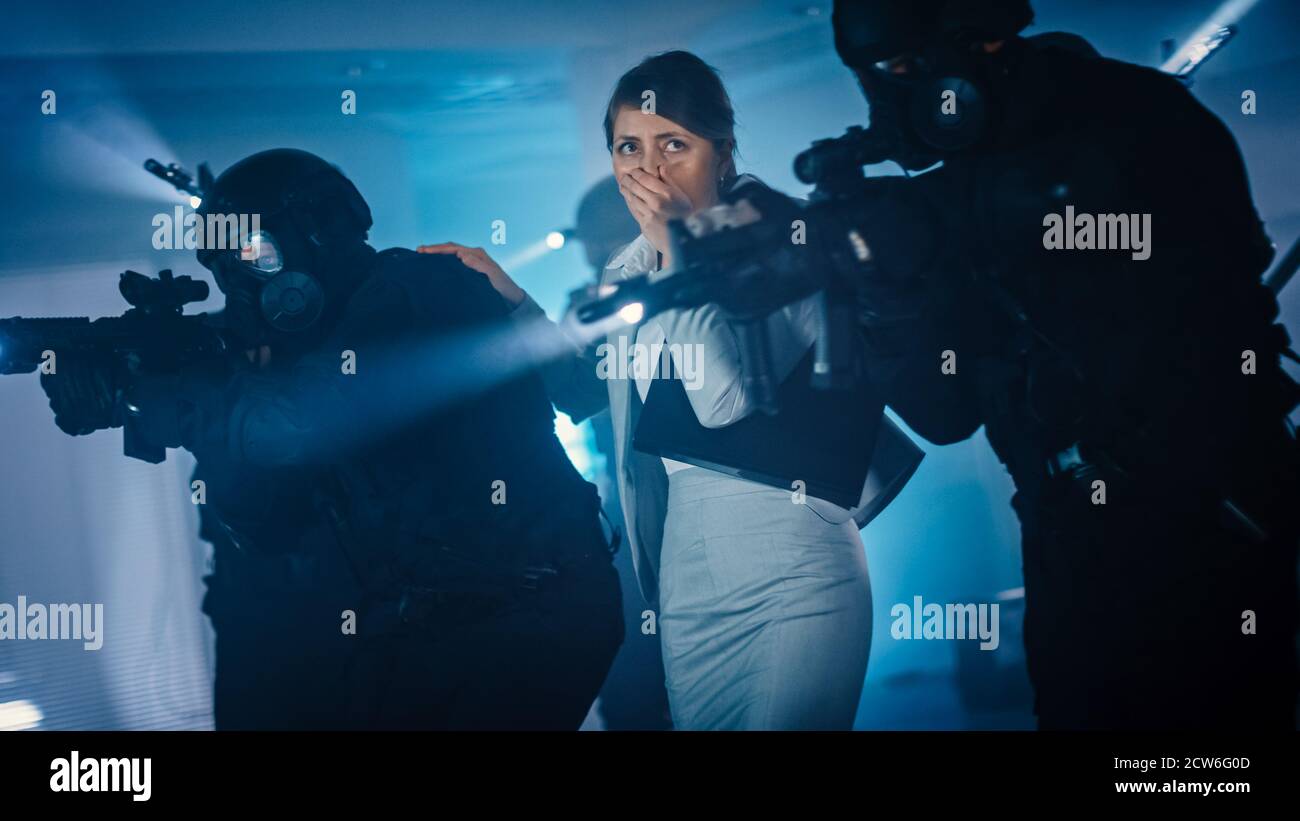 Masked Squad of Armed SWAT Police Officers Rescue a Female Hostage in a ...