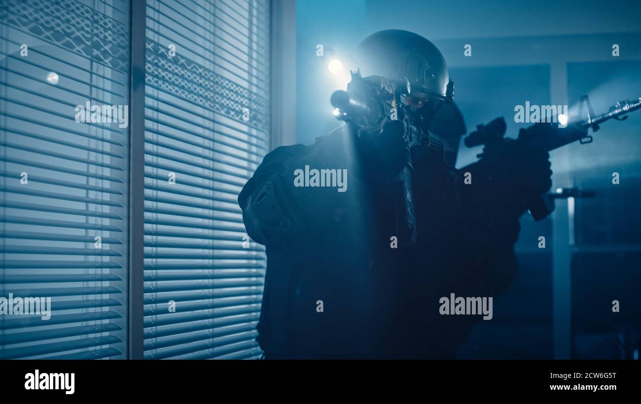 Close Up Portrait of Masked Armed SWAT Police Officer Storm a Dark ...