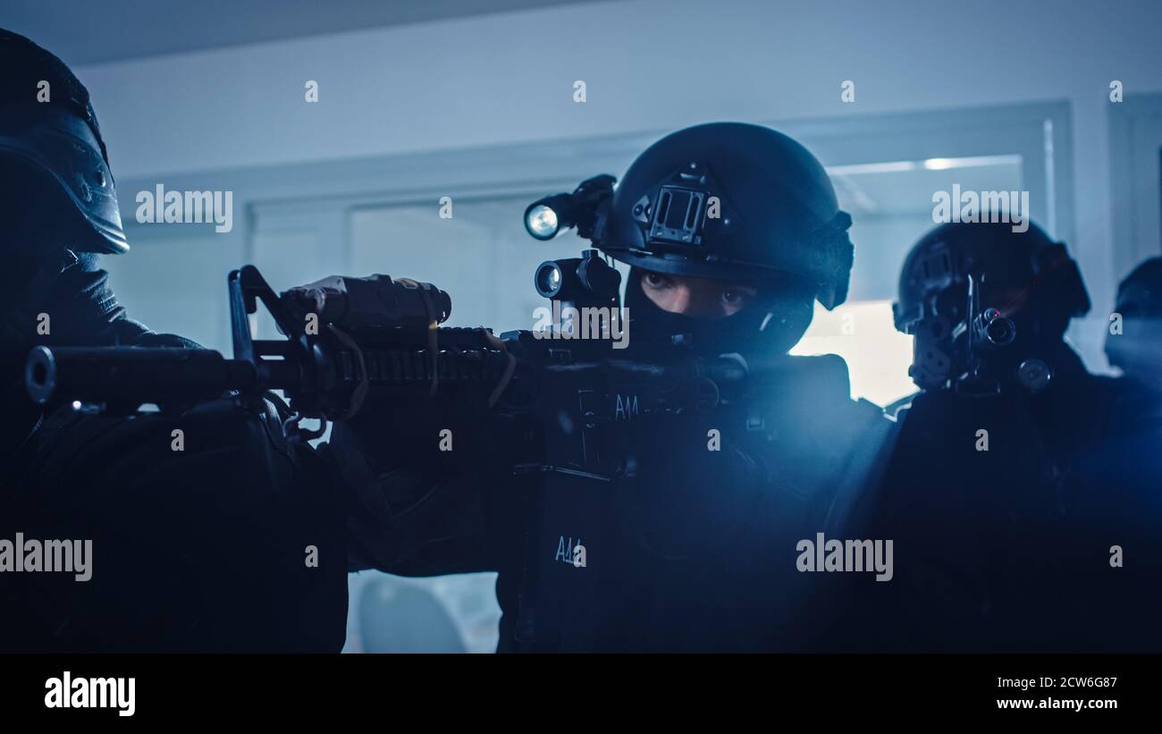 Close Up Portraits of Masked Squad of Armed SWAT Police Officers Storm ...