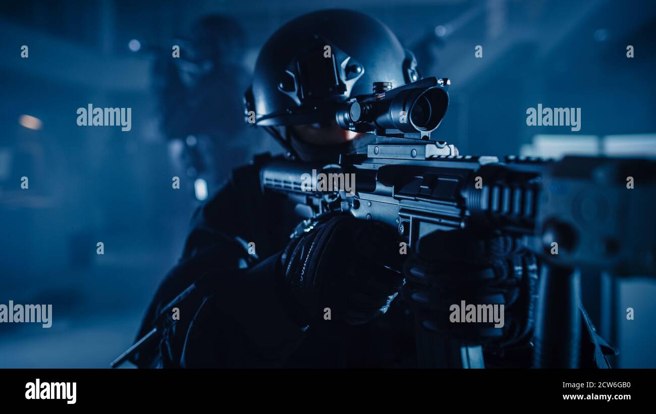 Close Up Portrait of Masked Squad Member of Armed SWAT Police Officers ...