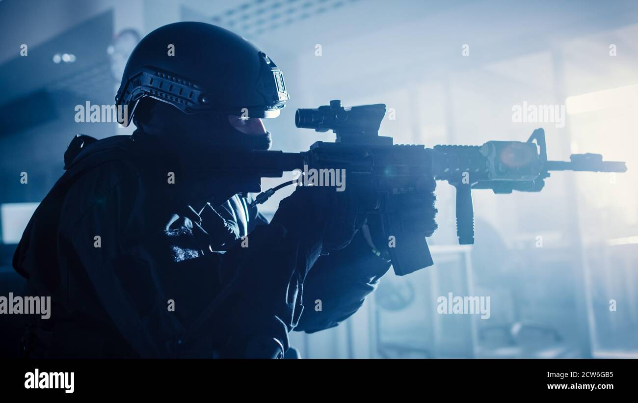 Close Up Portrait of Masked Squad Member of Armed SWAT Police Officers ...