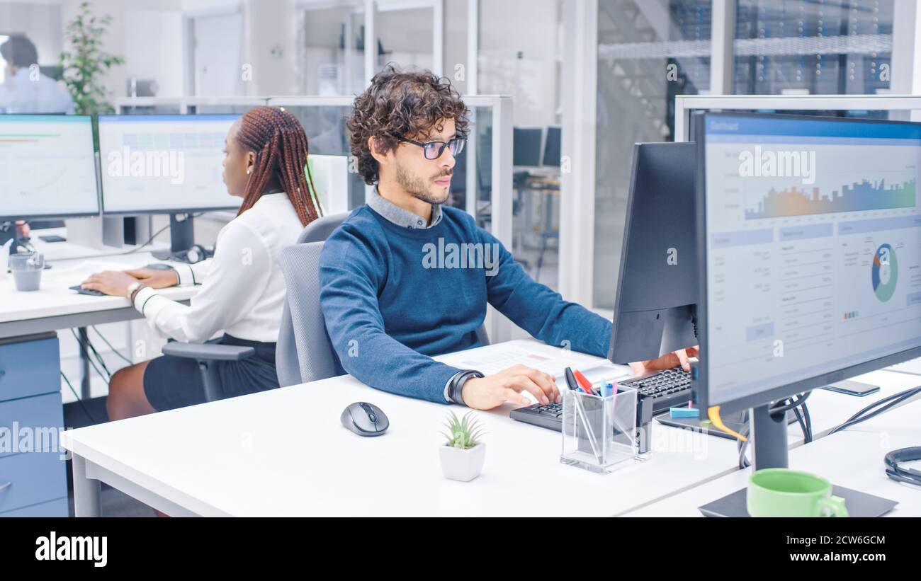 In the Big Busy Corporate Office Professional Worker Using Desktop ...