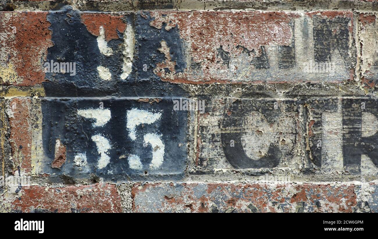 White stencil numbers on red brick hi-res stock photography and images ...