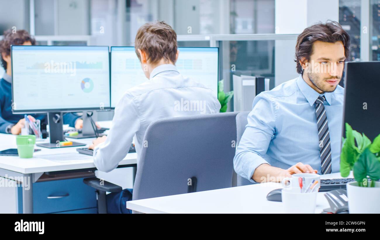 In the Big Busy Corporate Office Businessman Works on Desktop Computer ...