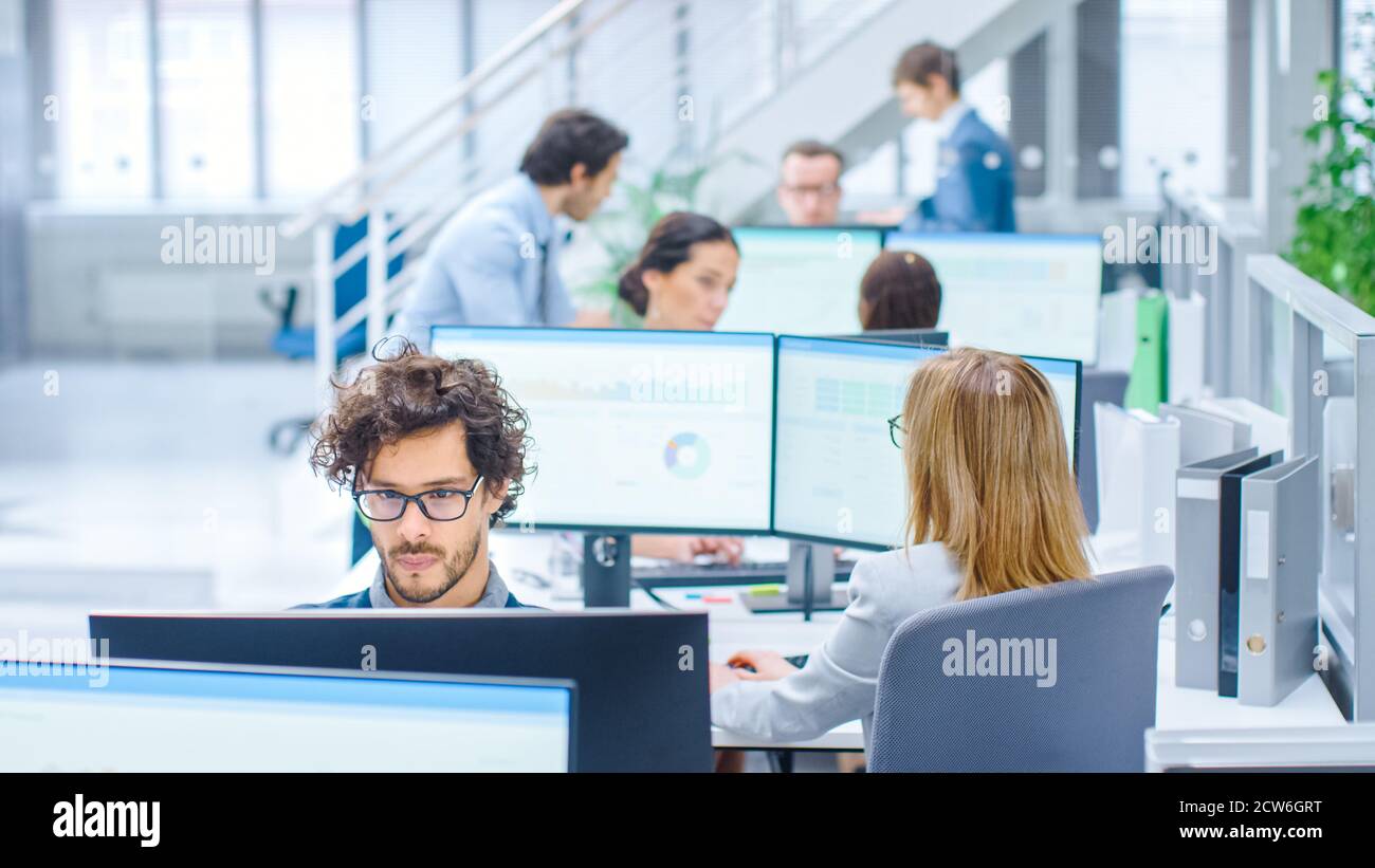 Rows of people working computers hi-res stock photography and images ...