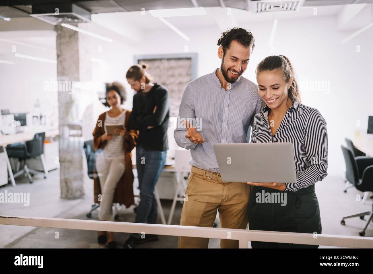 Programmers cooperating at IT company developing apps Stock Photo - Alamy